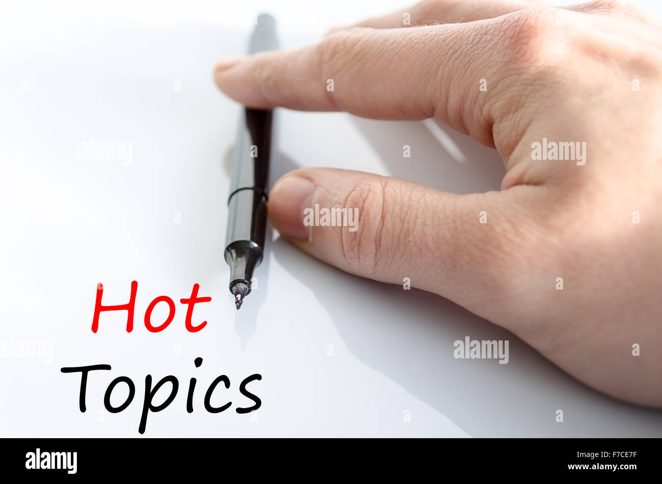 Hot topics text concept isolated over white background Stock Photo - Alamy