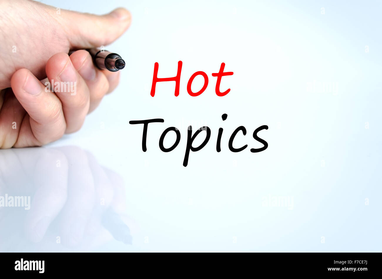 Hot topics text concept isolated over white background Stock Photo - Alamy