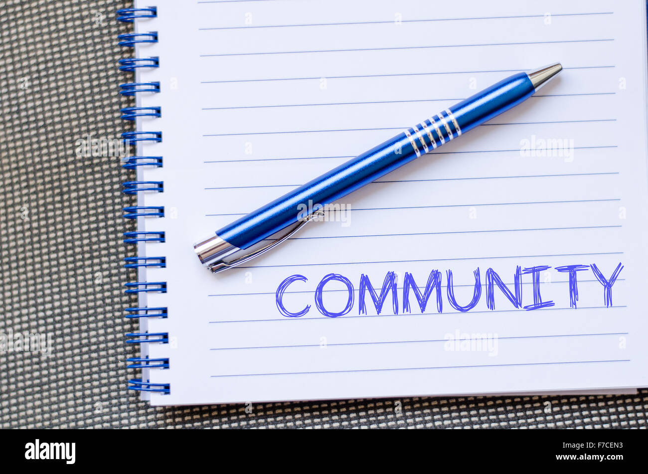 Community text concept write on notebook with pen Stock Photo - Alamy
