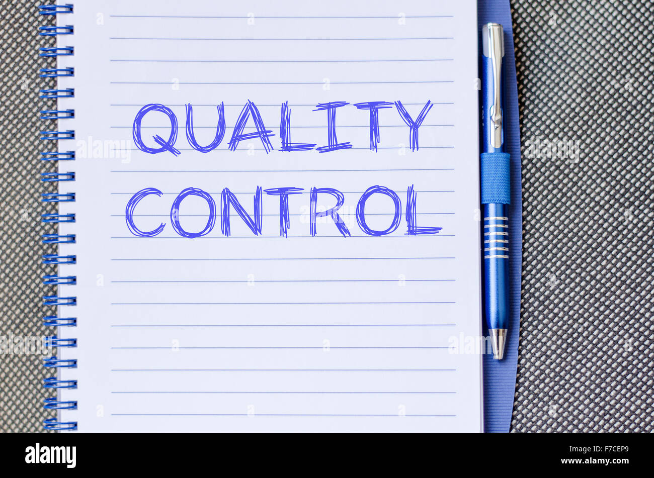 Quality control text concept write on notebook with pen Stock Photo - Alamy