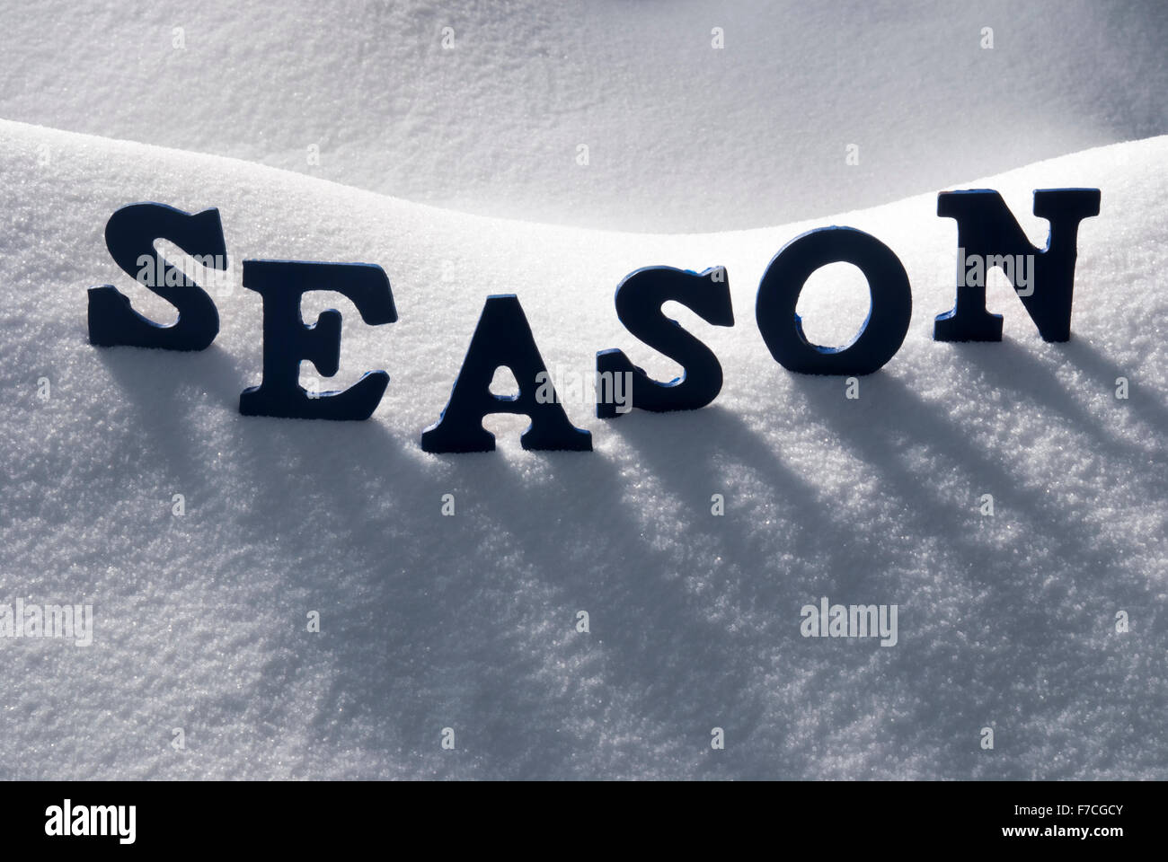 Blue Word Season On Snow Stock Photo - Alamy