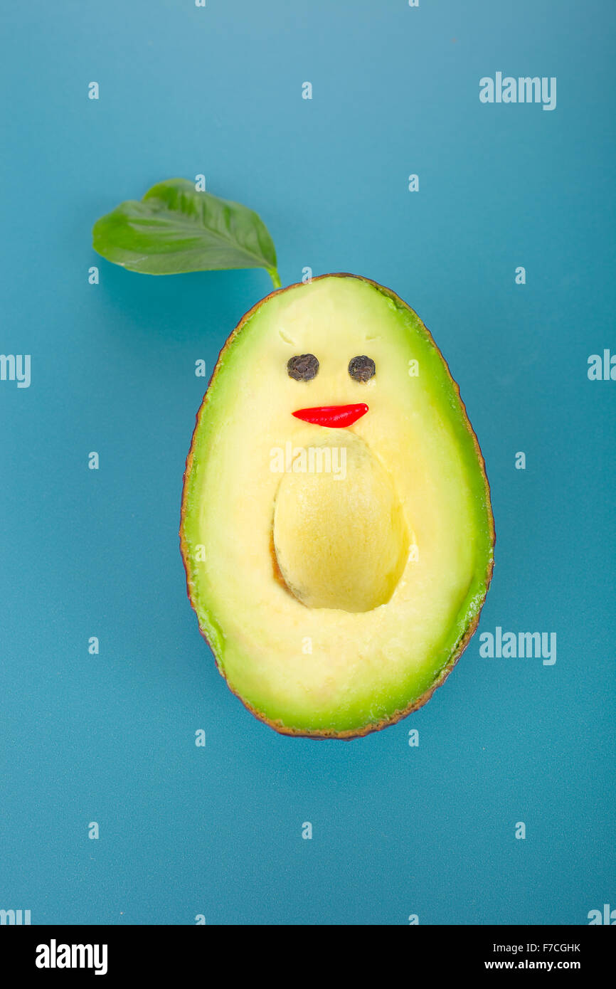 Funny food- avocado half Stock Photo - Alamy