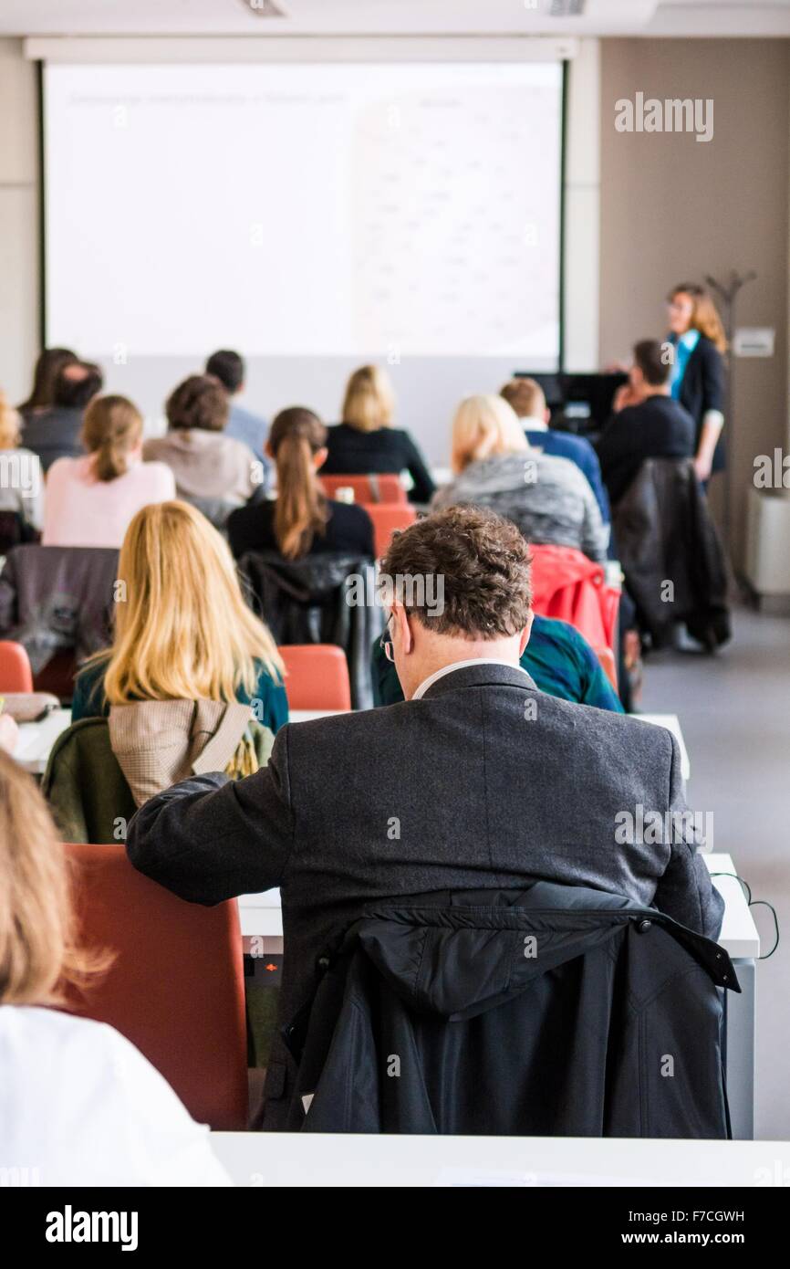 Person attending a conference Stock Photo - Alamy