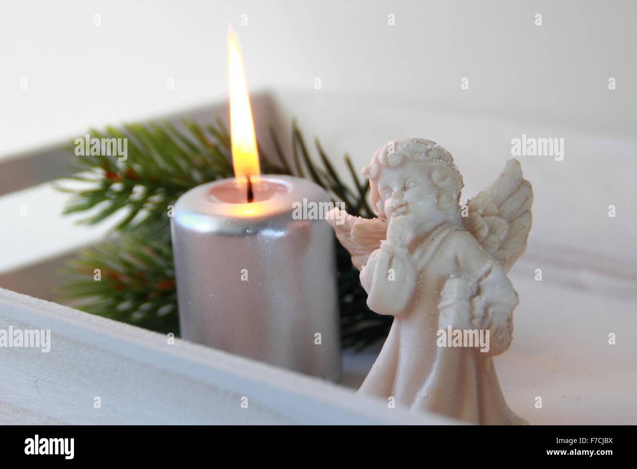 Candle with angel Stock Photo - Alamy