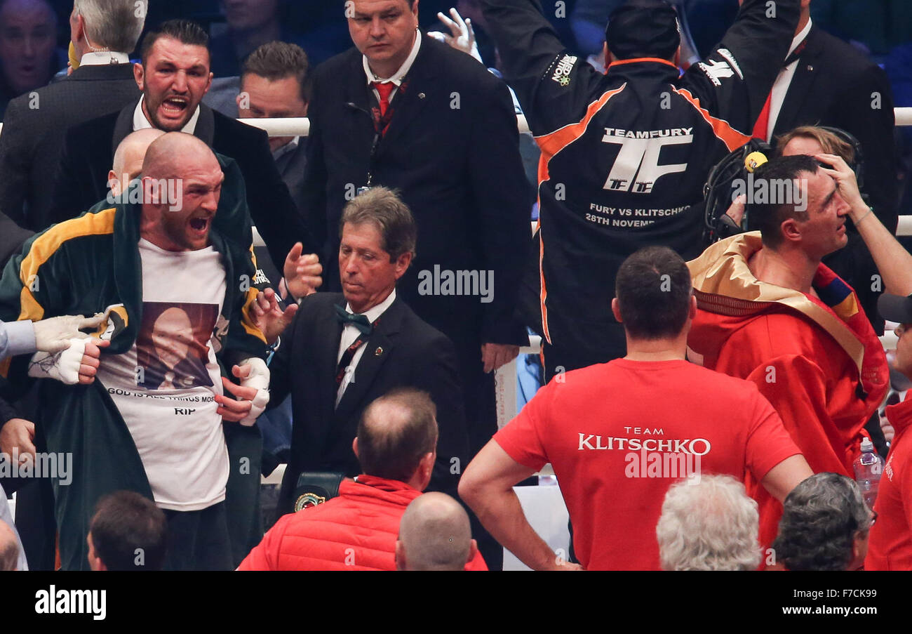 British boxer Tyson Fury (L) celebrates in the ring after his victory ...