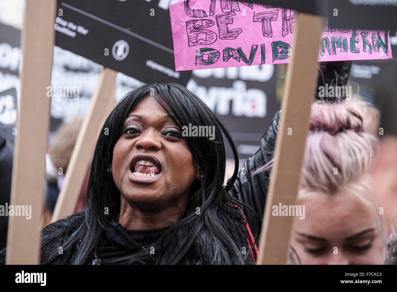 An angry demonstrator yelling slogans amongst protesters as they gather ...
