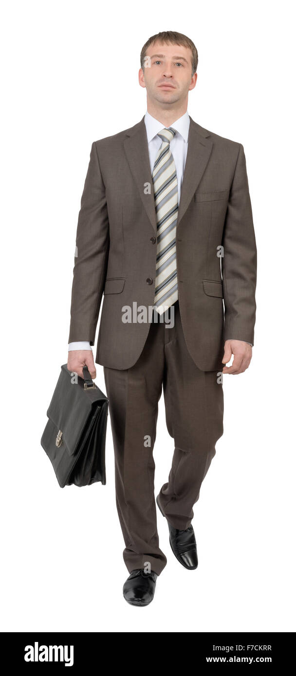 Businessman walking forward Stock Photo - Alamy