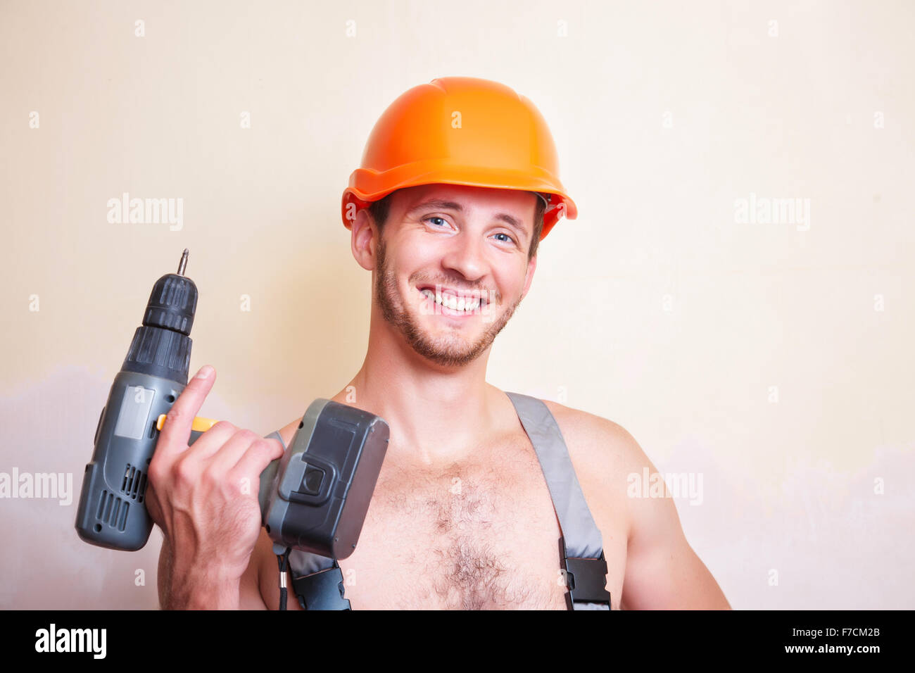 Man in helmet overalls hi-res stock photography and images - Alamy