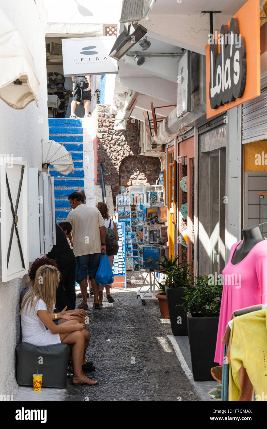 Santorini, Thira. Typical very narrow shopping street in Fira town. Row ...