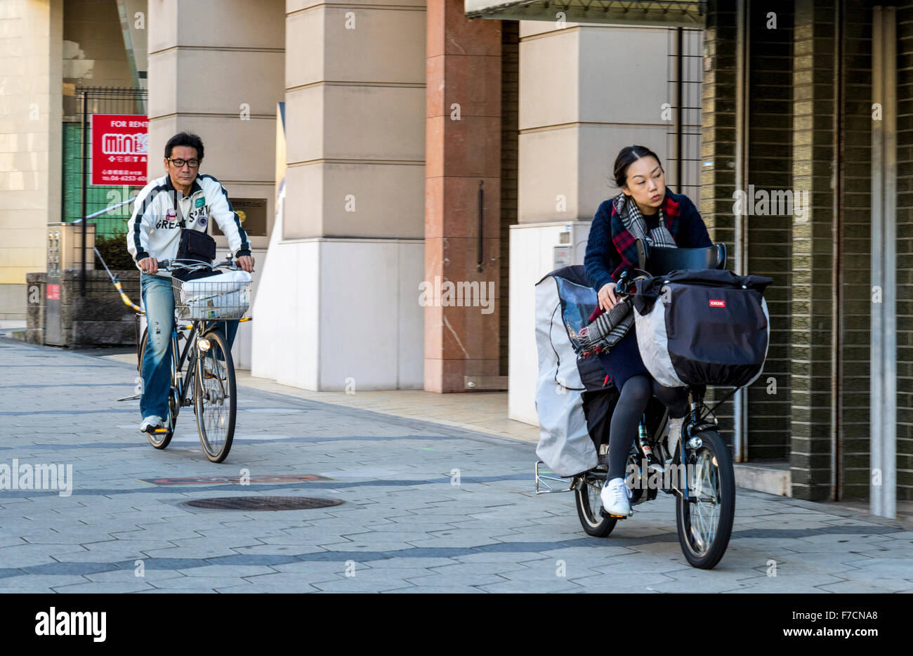 Cycling in the city of Osaka Japan along one of the many cycle paths ...