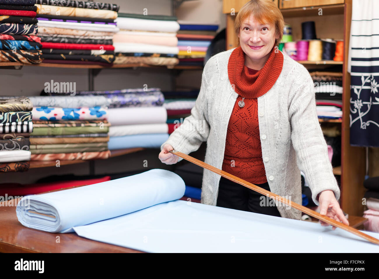 salesclerk works in the tissue store Stock Photo - Alamy