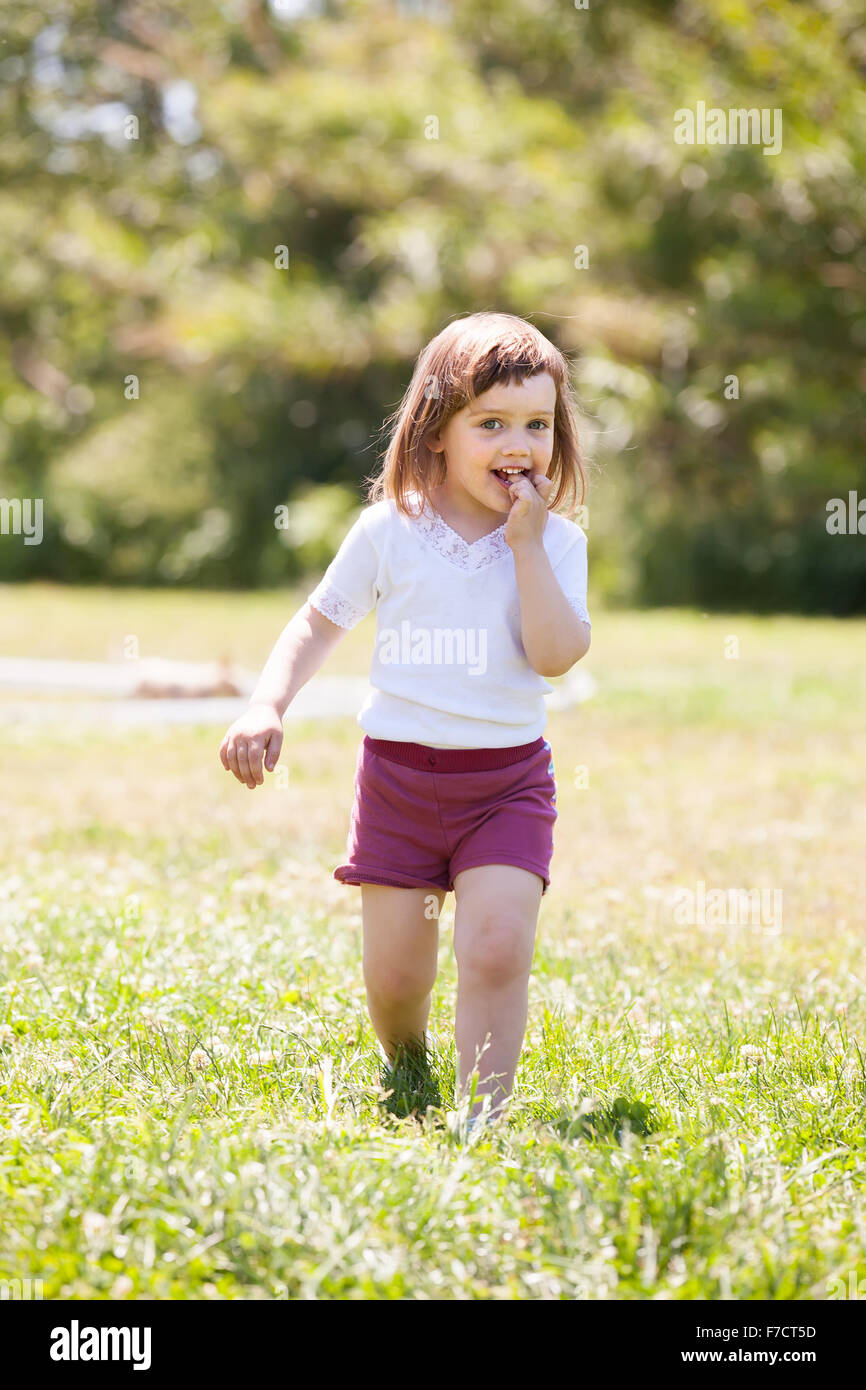 Two-year baby girl in summer meadow Stock Photo - Alamy
