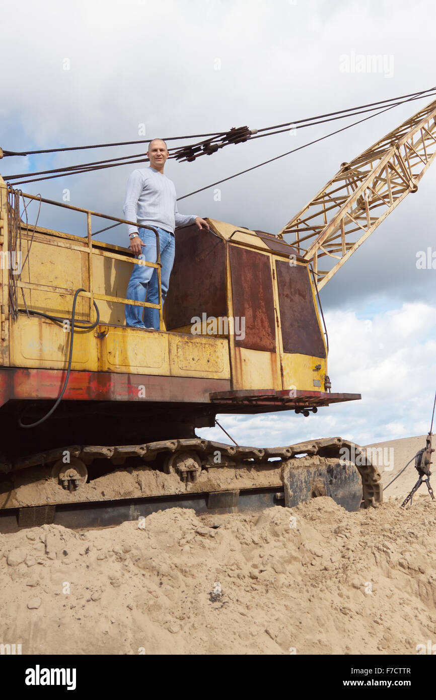 Portrait of tractor operator at sand pit Stock Photo - Alamy