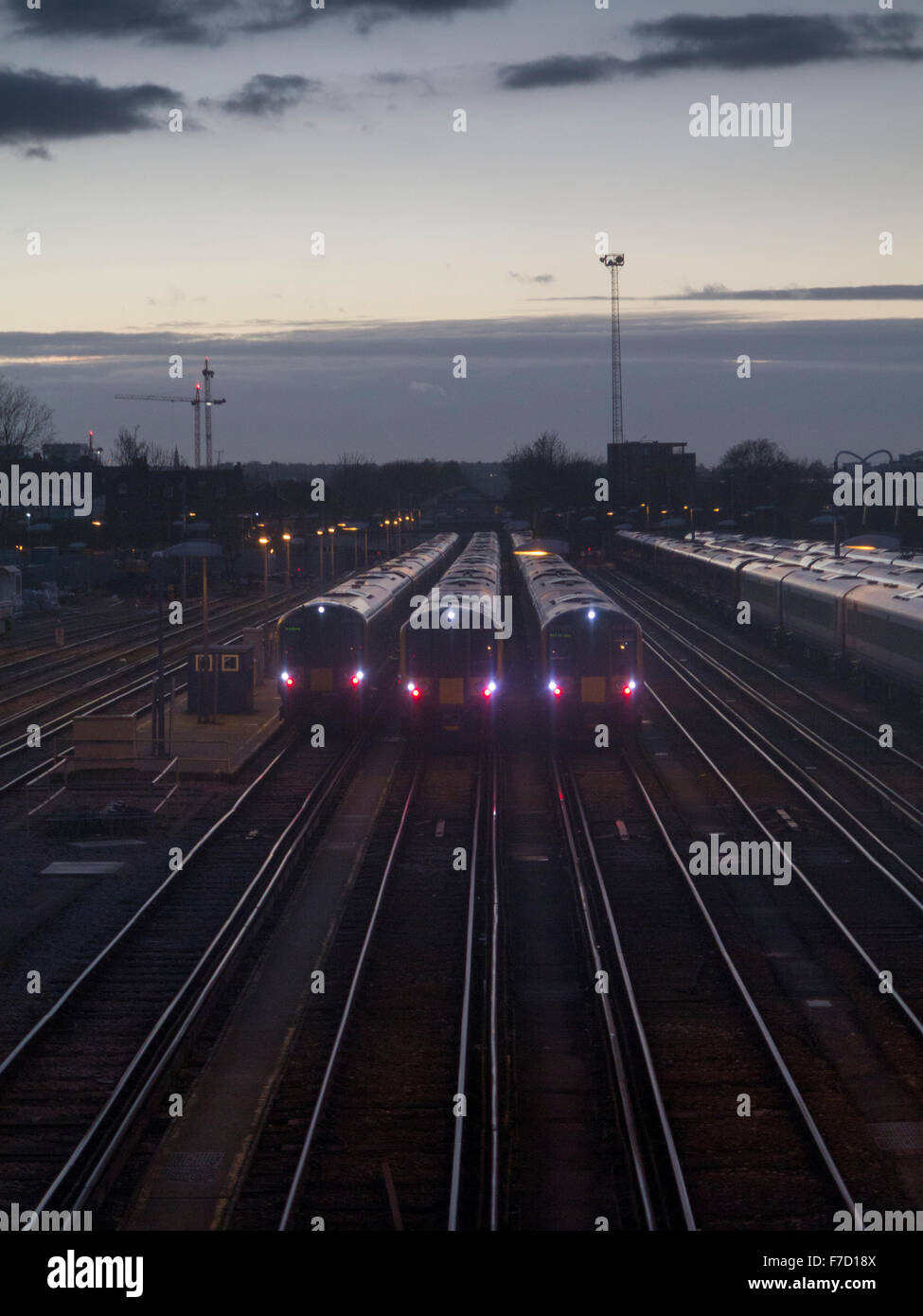 Trains in the dusk at Clapham Junction Stock Photo - Alamy