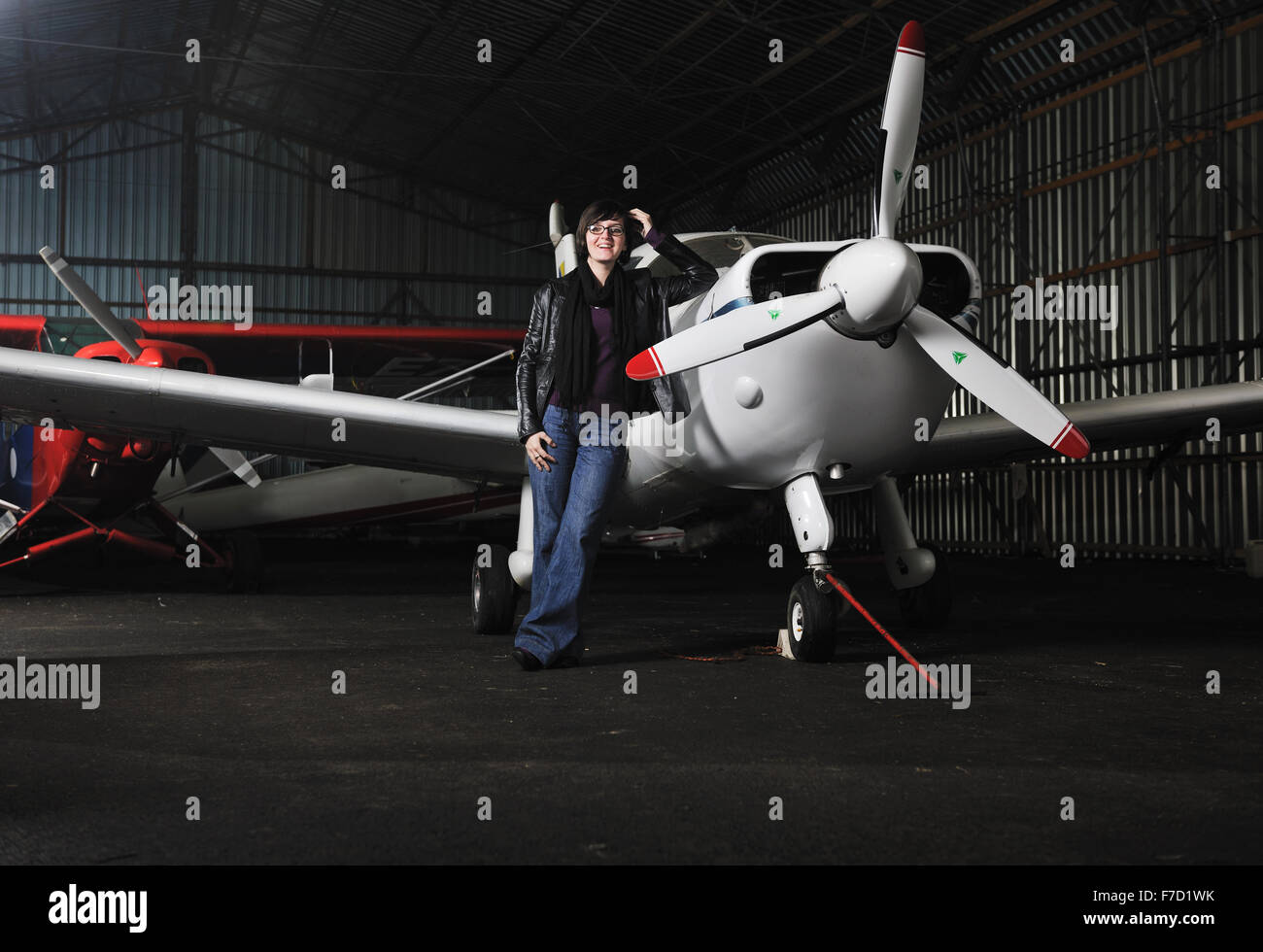 beautiful young woman model in fashion clothes posing in front of old ...