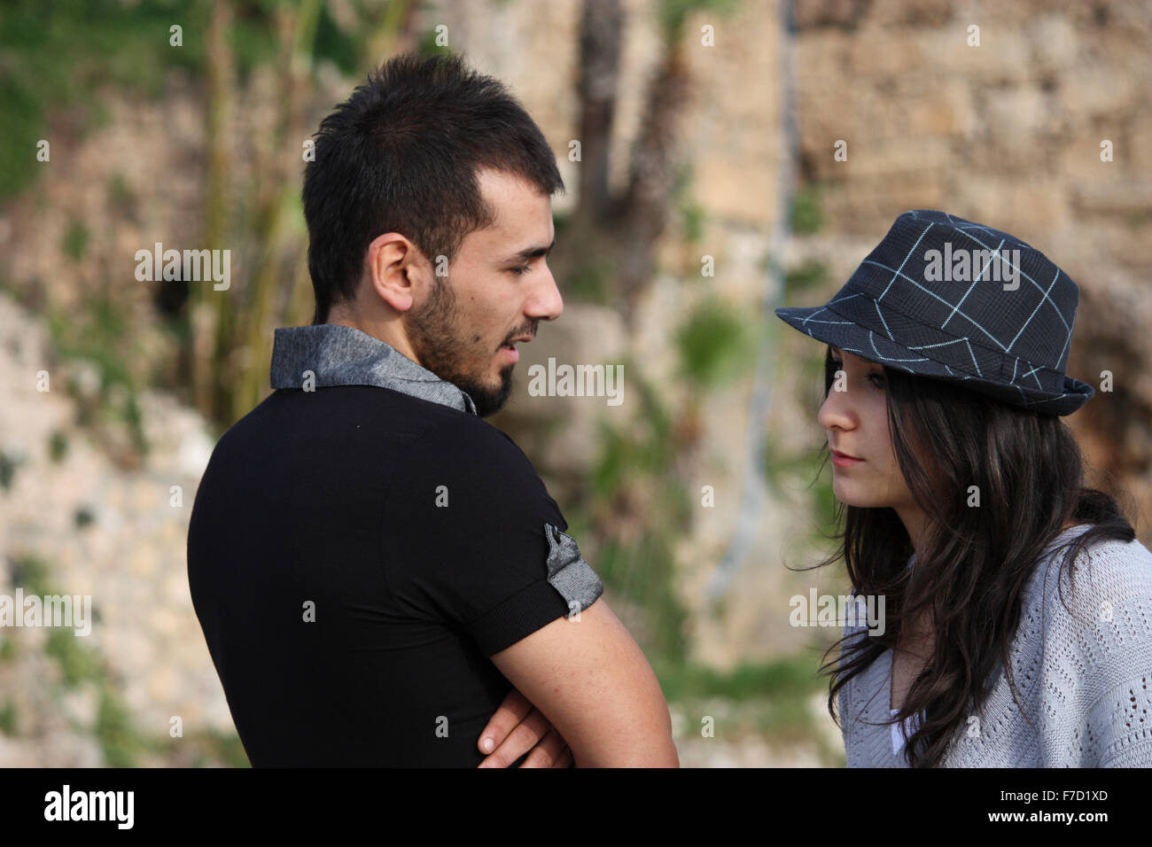 A young Turkish couple talking Stock Photo - Alamy