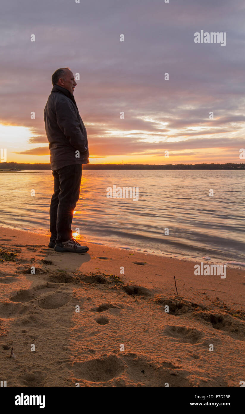 bright sky with man at sunset Stock Photo - Alamy