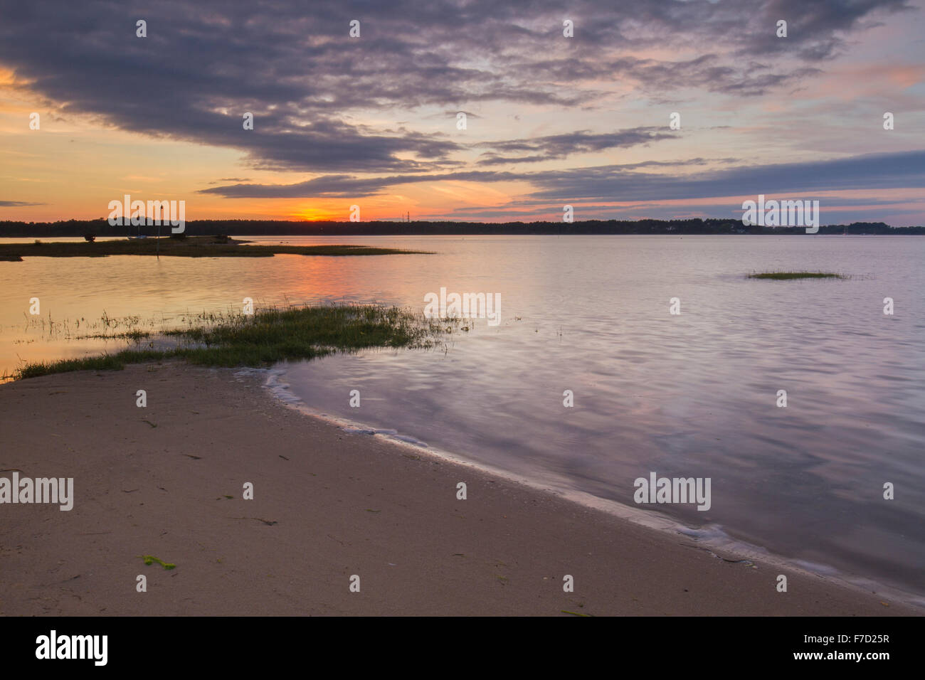 sandy bay with gorgeous sunset Stock Photo - Alamy