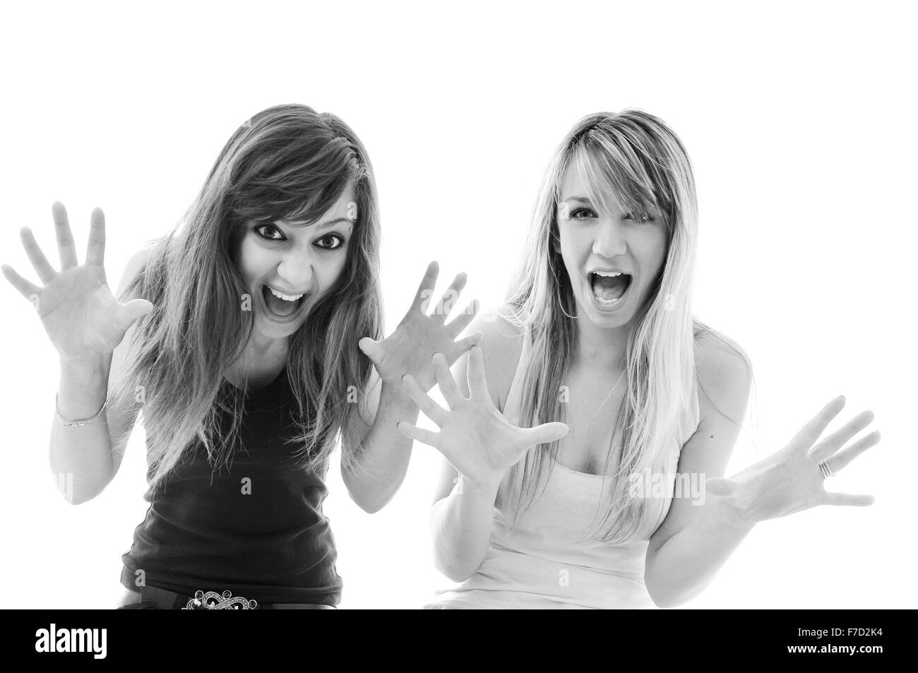 two young woman scream isolated emotion pair group Stock Photo - Alamy