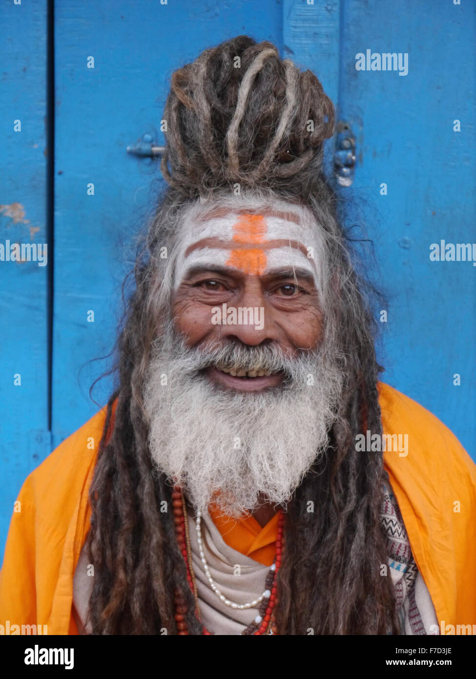 Portrait of a Sadu . Smiling image of holy man dressed in vivid ...