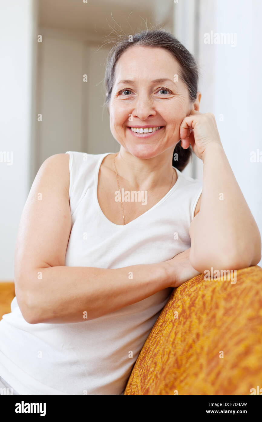 Portrait of smiling mature woman in home Stock Photo - Alamy