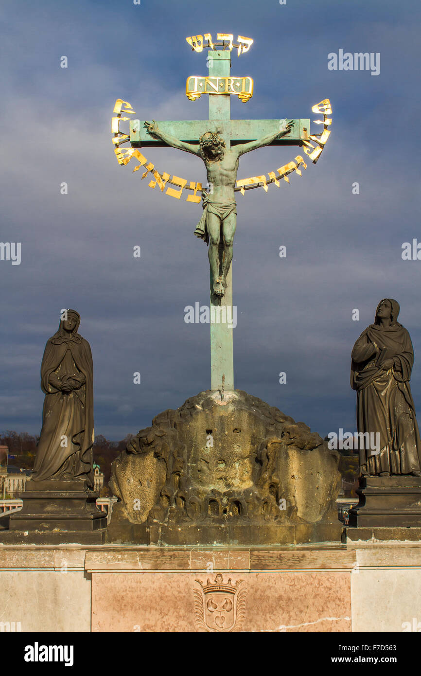 Statue of the Crucifix and Calvary at Charles Bridge in Prague Stock ...