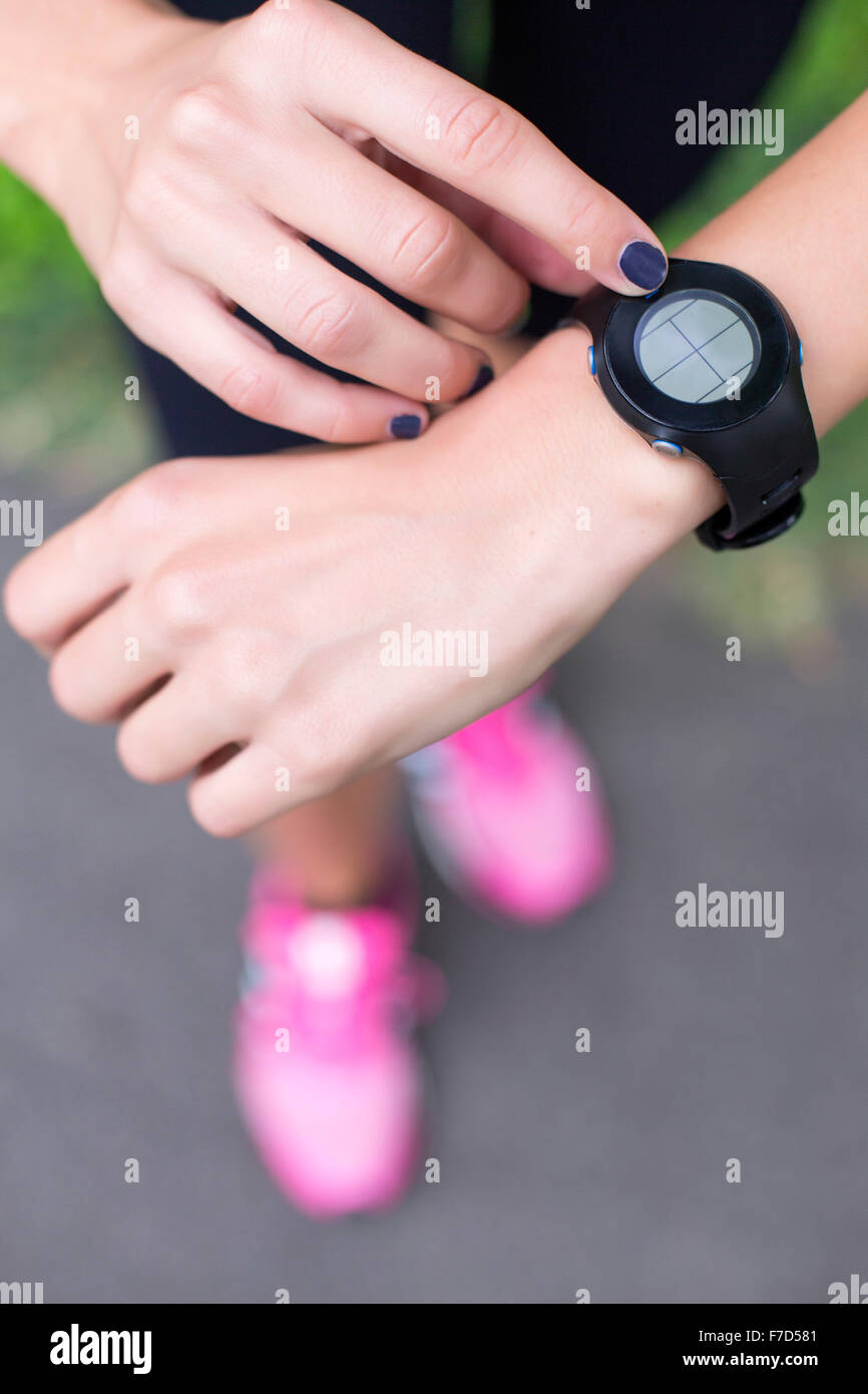 Young woman watching on the watch Stock Photo - Alamy