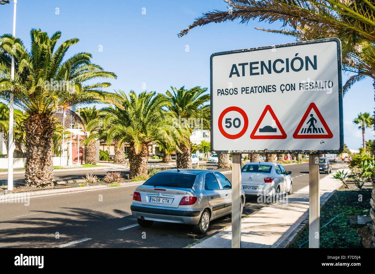 Road sign warning drivers to slow down due to road humps and pedestrian ...