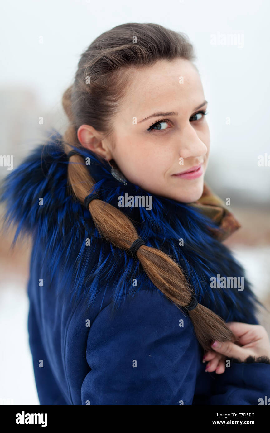 Outdoor winter portrait of woman in blue coat at wintry park Stock ...