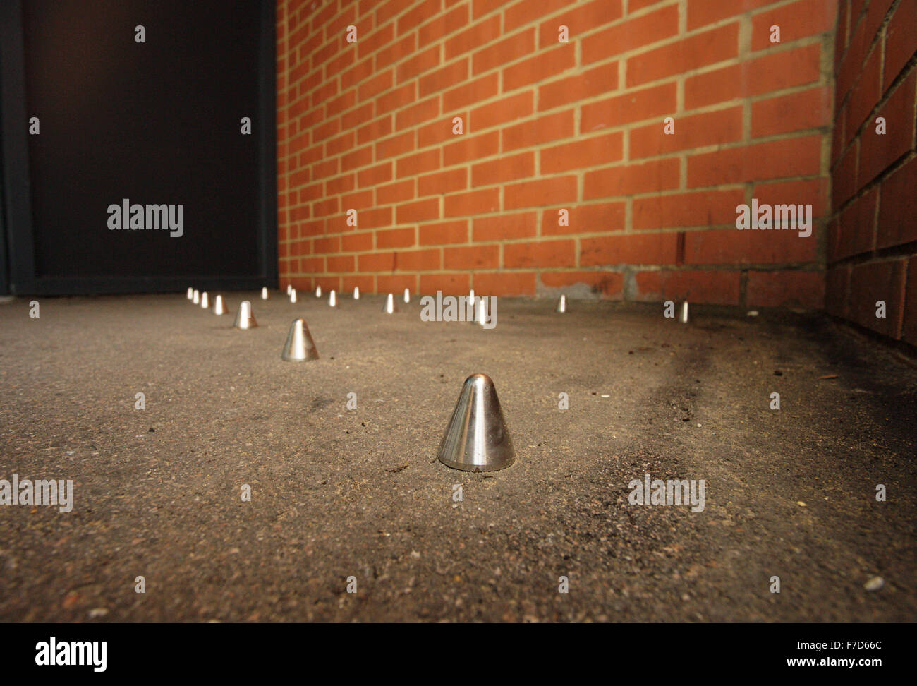 Anti-Homeless spikes installed next to the entrance to a block of ...