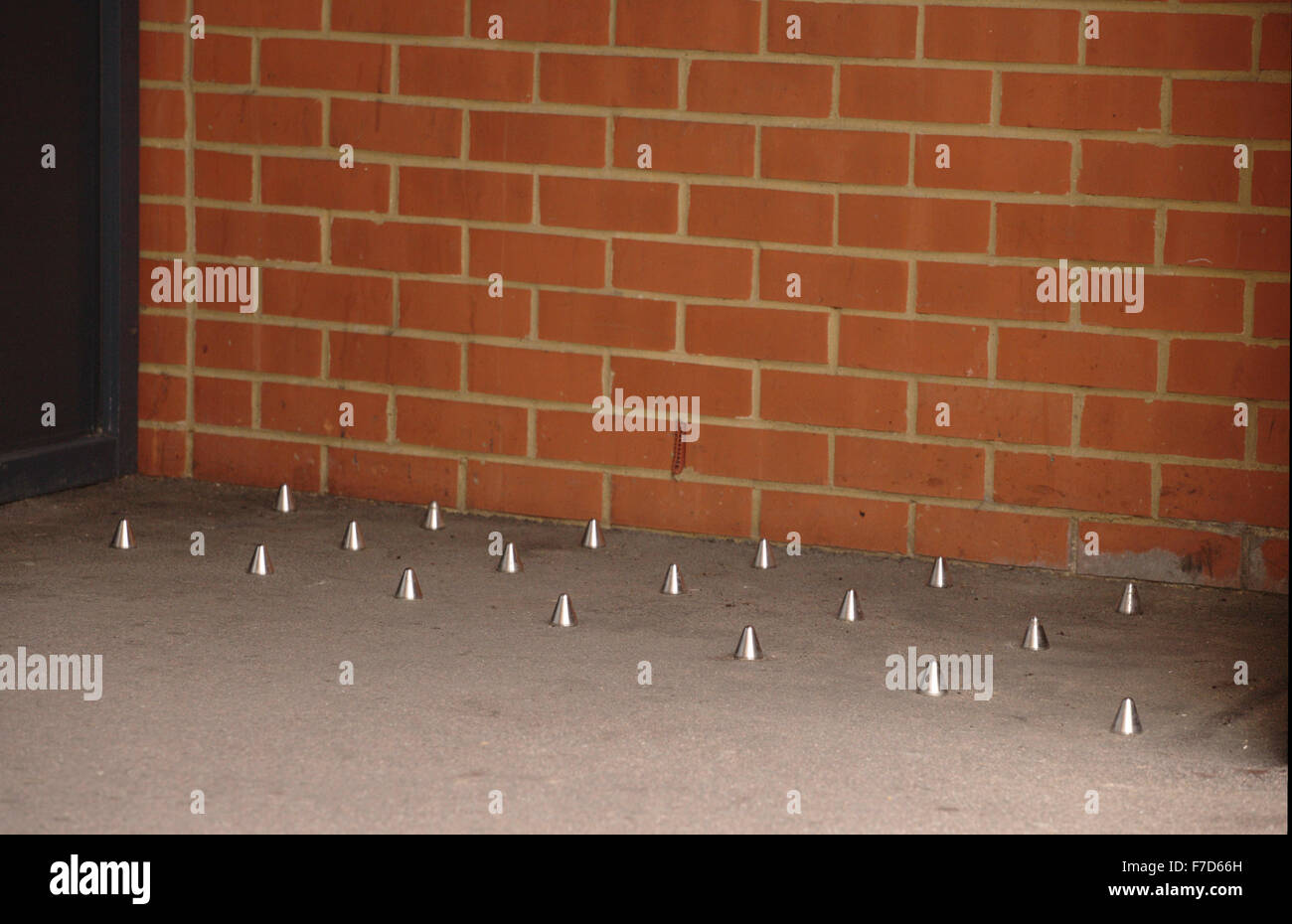 Anti-Homeless spikes installed next to the entrance to a block of ...
