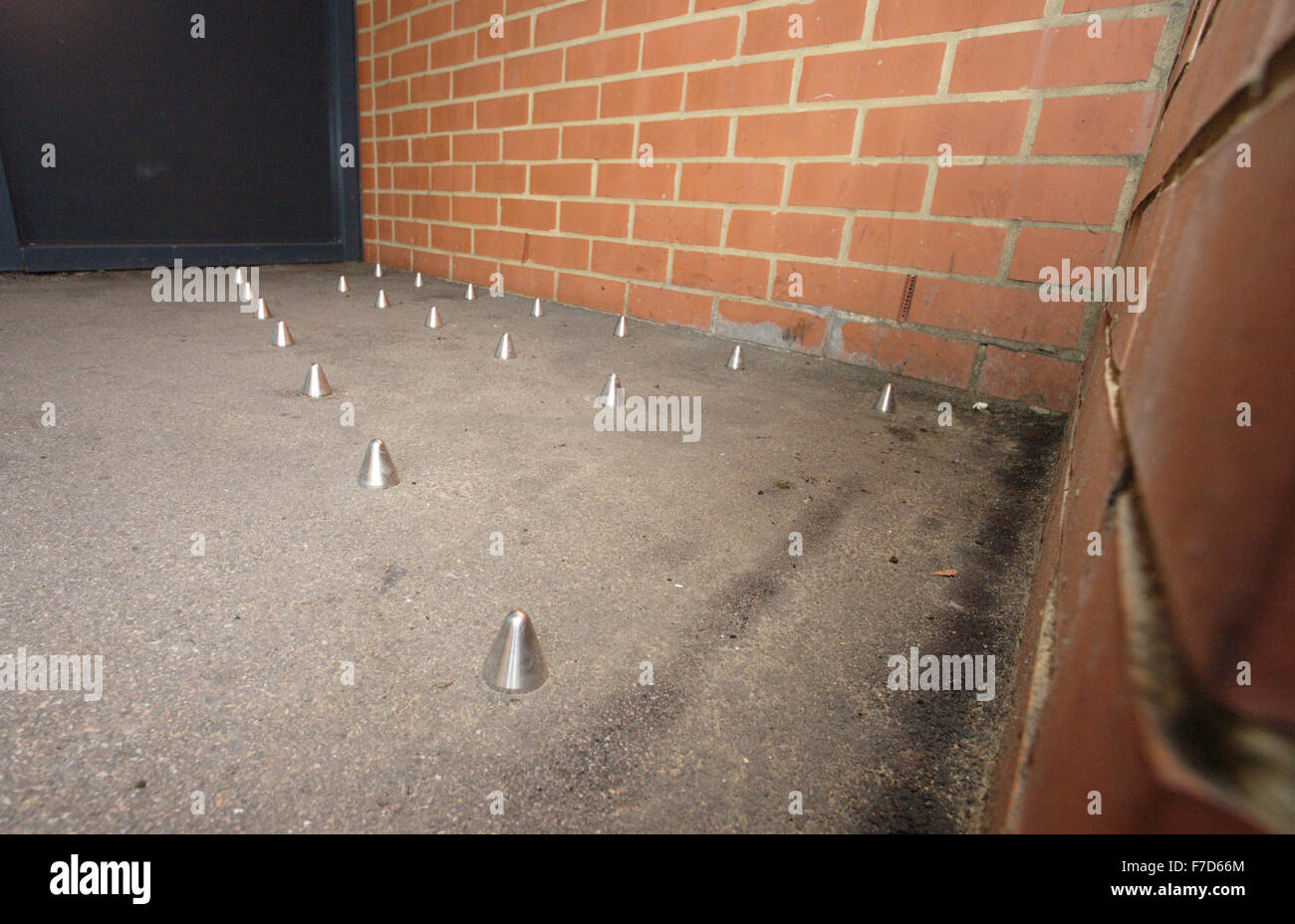 Anti-Homeless spikes installed next to the entrance to a block of ...