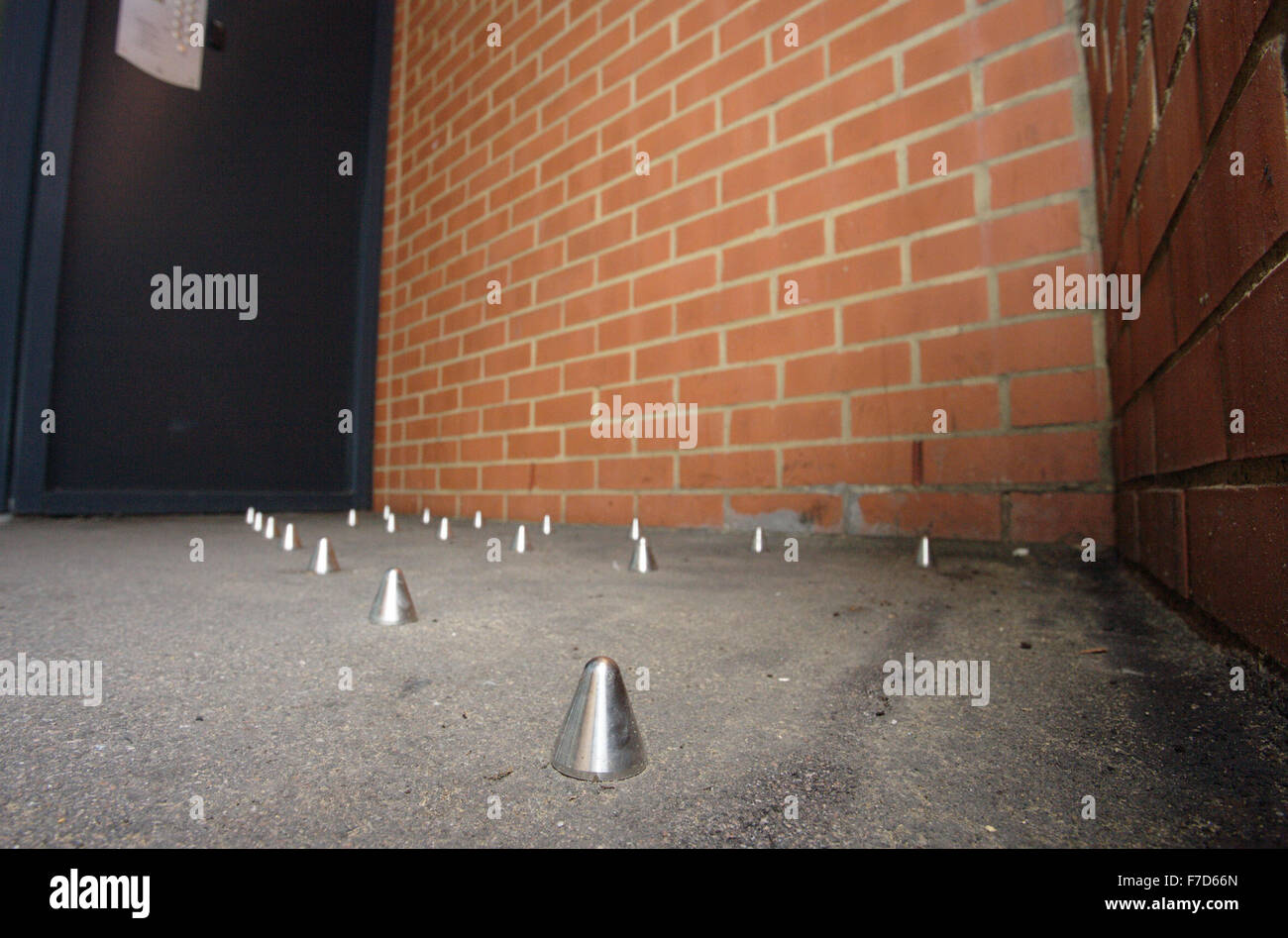 Anti-Homeless spikes installed next to the entrance to a block of ...