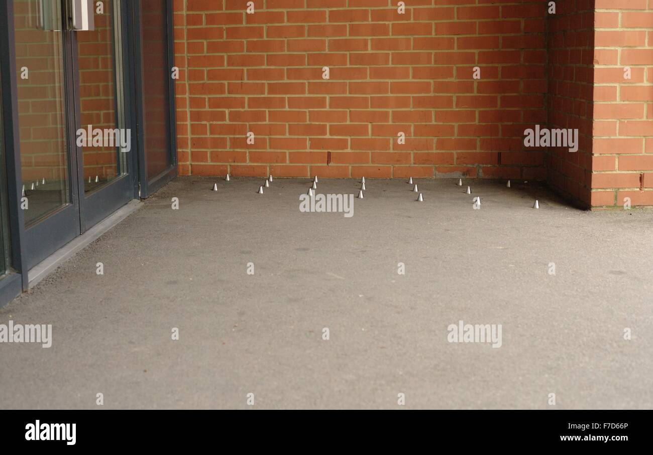 Anti-Homeless spikes installed next to the entrance to a block of ...