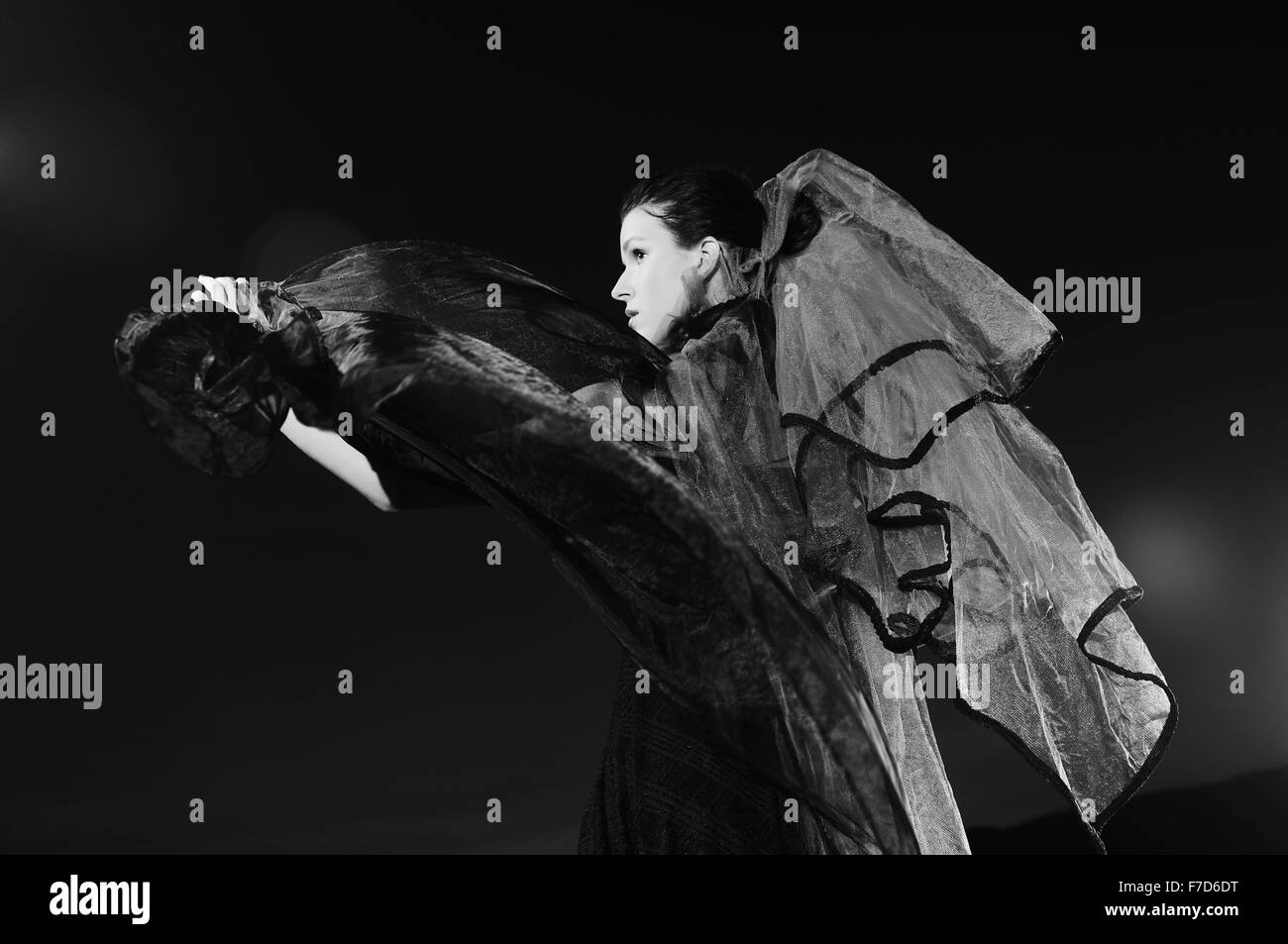 young beautiful bride in black wedding dress in dar at night Stock ...