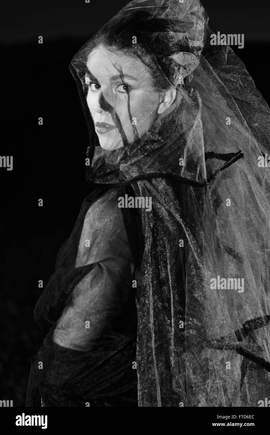 young beautiful bride in black wedding dress in dar at night Stock ...