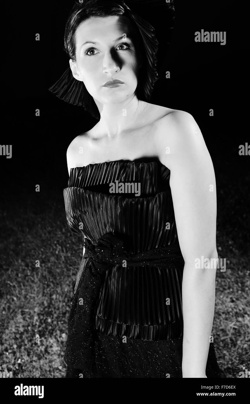 young beautiful bride in black wedding dress in dar at night Stock ...