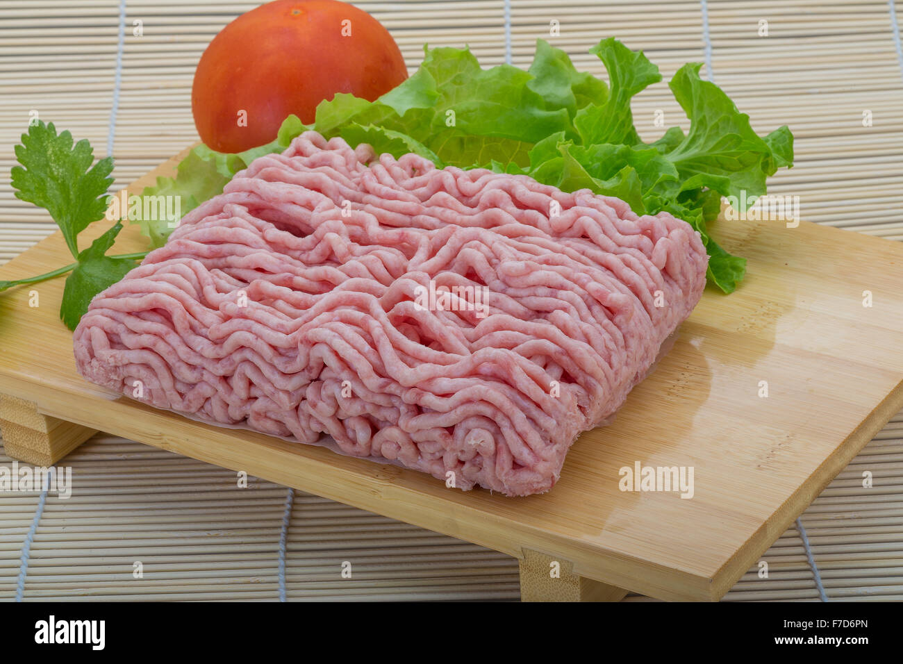 Raw minced pork meat on the desk with herbs Stock Photo - Alamy