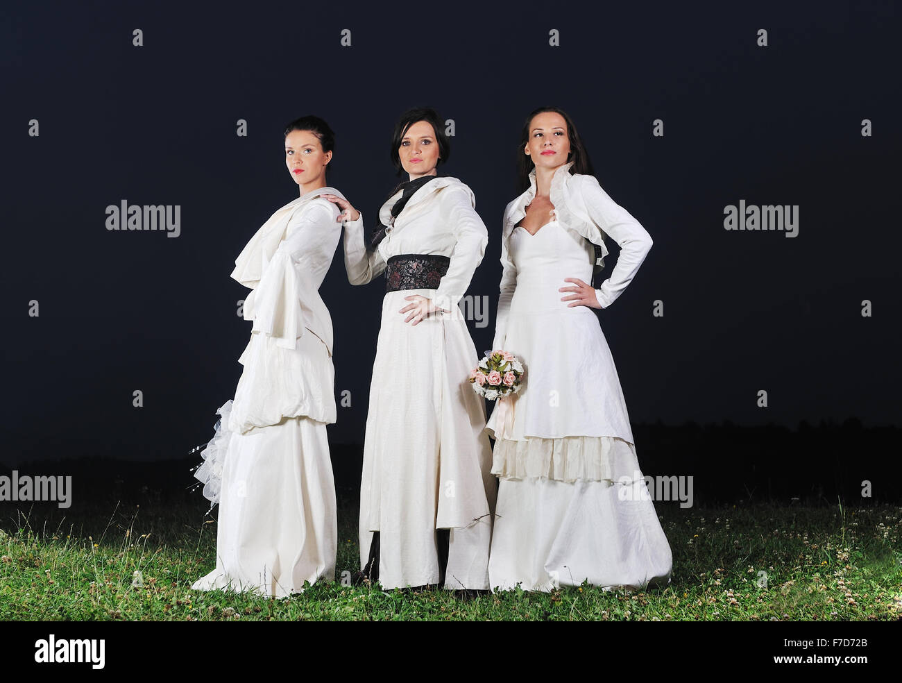 group of bride run on meadow at sunset after wedding party Stock Photo ...