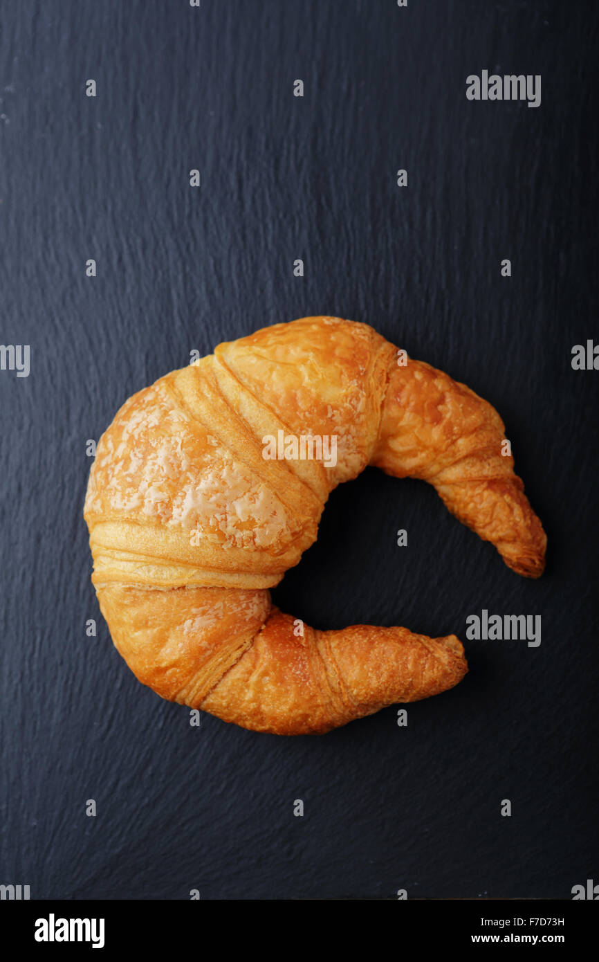 fresh croissant on slate, top view Stock Photo - Alamy
