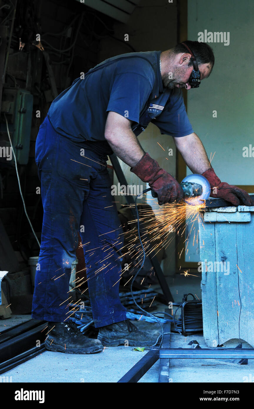 industry worker cut steel with spinning machine and spark Stock Photo ...