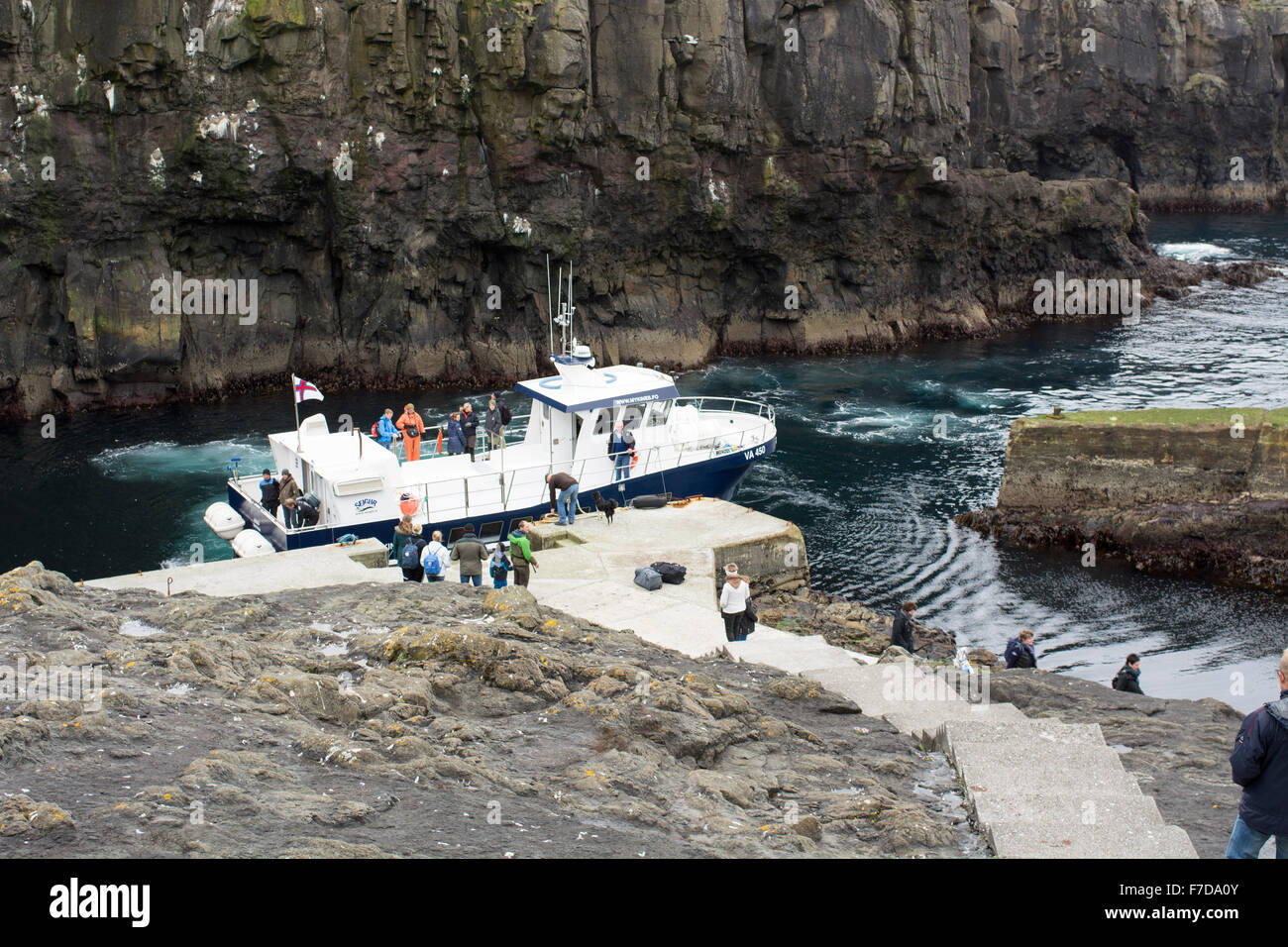 Post boat Jósup in the harbor of Mykines island harbor on the Faroe ...