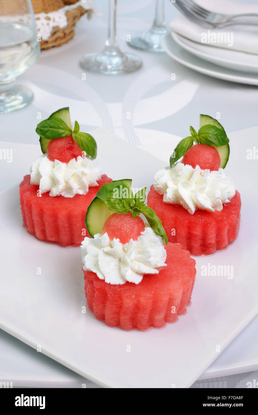 Chilled melon appetizer with ricotta and basil Stock Photo - Alamy
