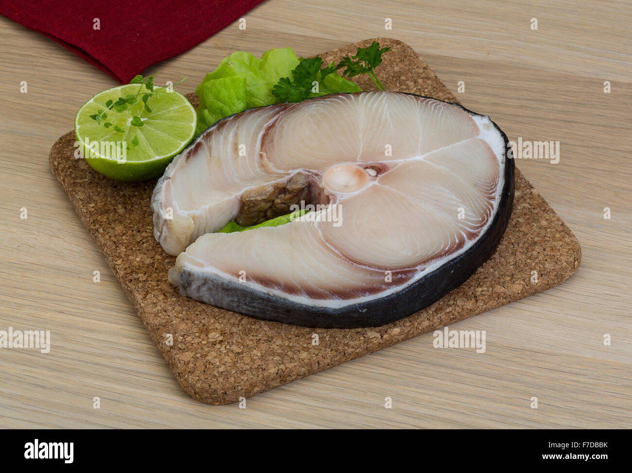 Raw blue shark steak with salad leaves and lime Stock Photo - Alamy