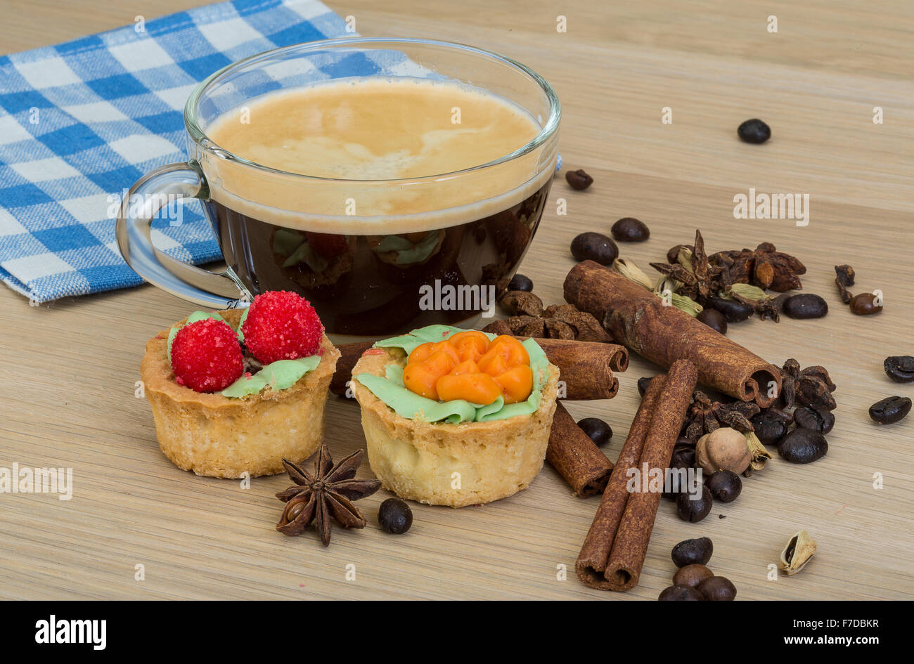 Coffee with sweet pastry and beans, cinnamon Stock Photo - Alamy
