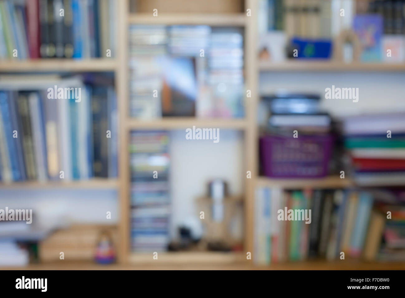 Blurred image of bookshelves with books Stock Photo - Alamy