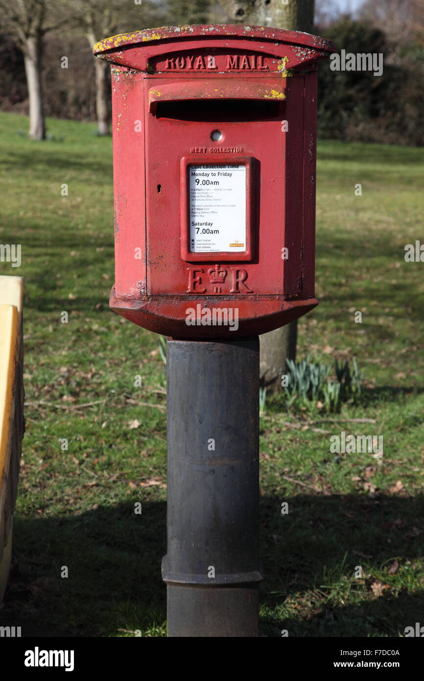 A large Red painted Letter box mounted on a pillar (pillar box) at the ...