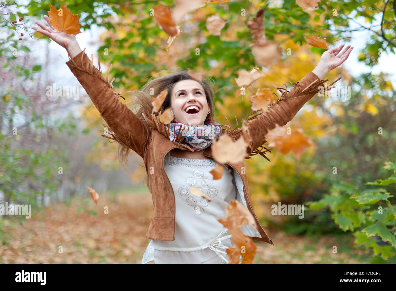 Girl throws up autumn hi-res stock photography and images - Alamy