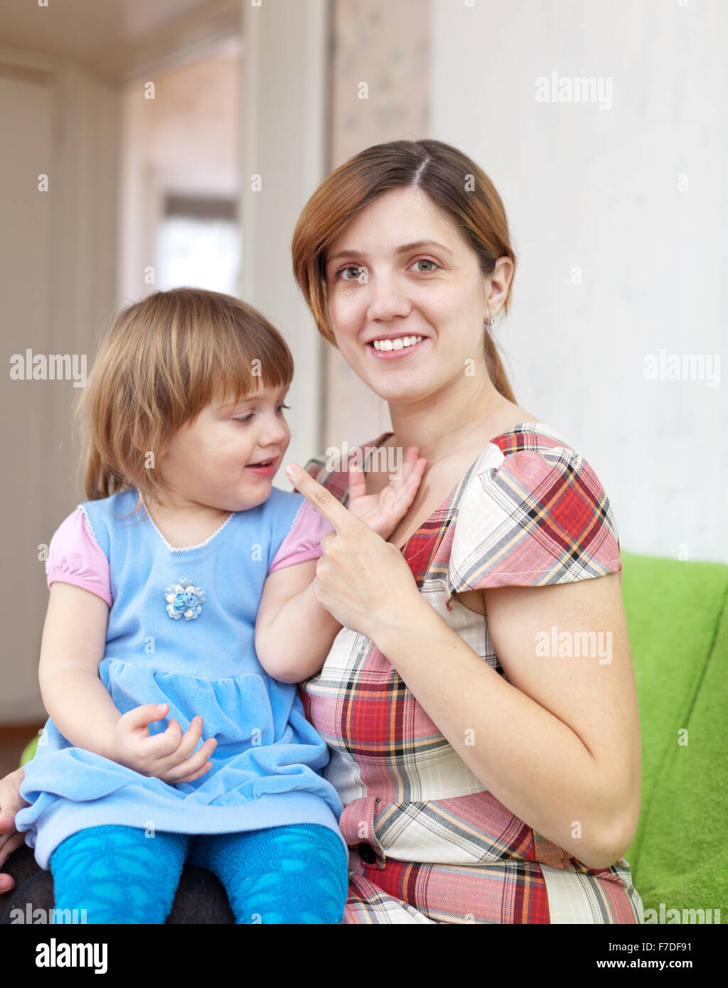 Mother scolds her child in home interior Stock Photo - Alamy
