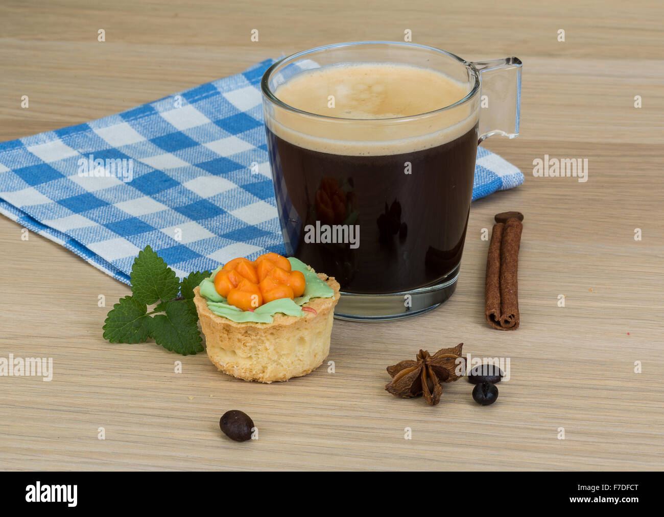 Coffee with sweet pastry and beans, cinnamon Stock Photo - Alamy